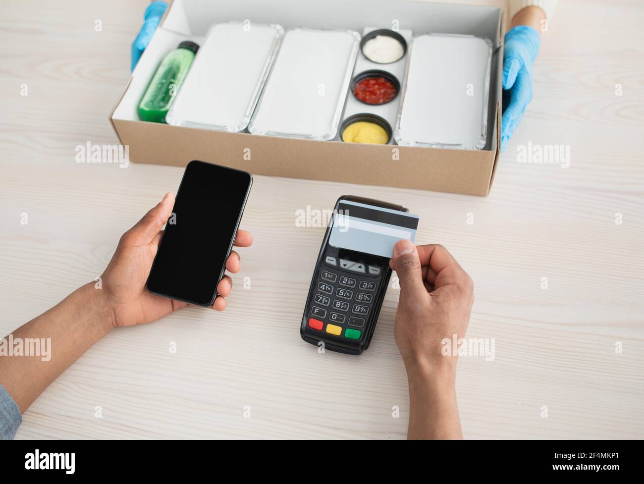 Covid-19 pandemic, app and food delivery at work and home Stock Photo ...