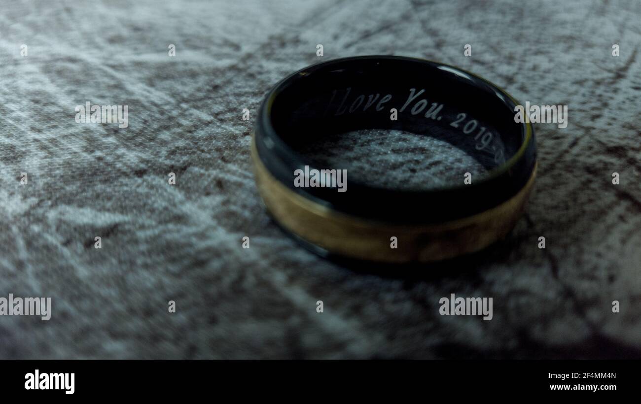 Engagement ring with an inscription Stock Photo - Alamy