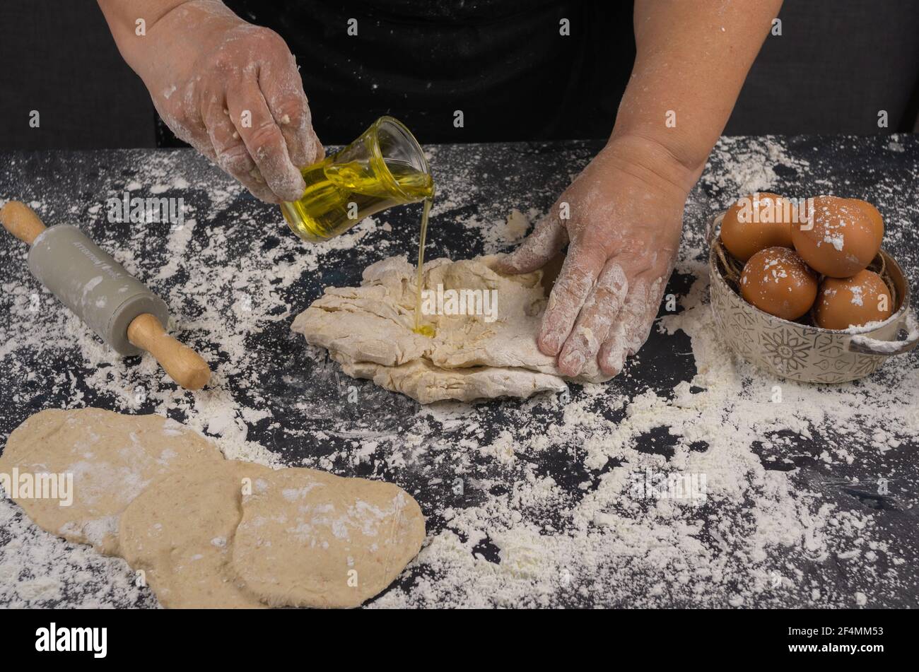kneading homemade bread with flour, water and salt Stock Photo - Alamy