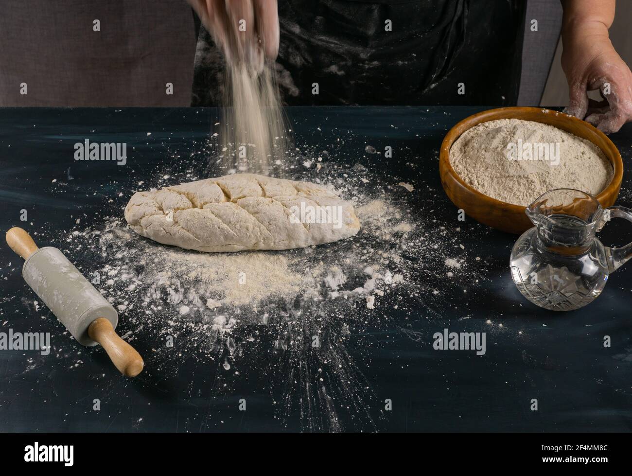 kneading homemade bread with flour, water and salt Stock Photo - Alamy