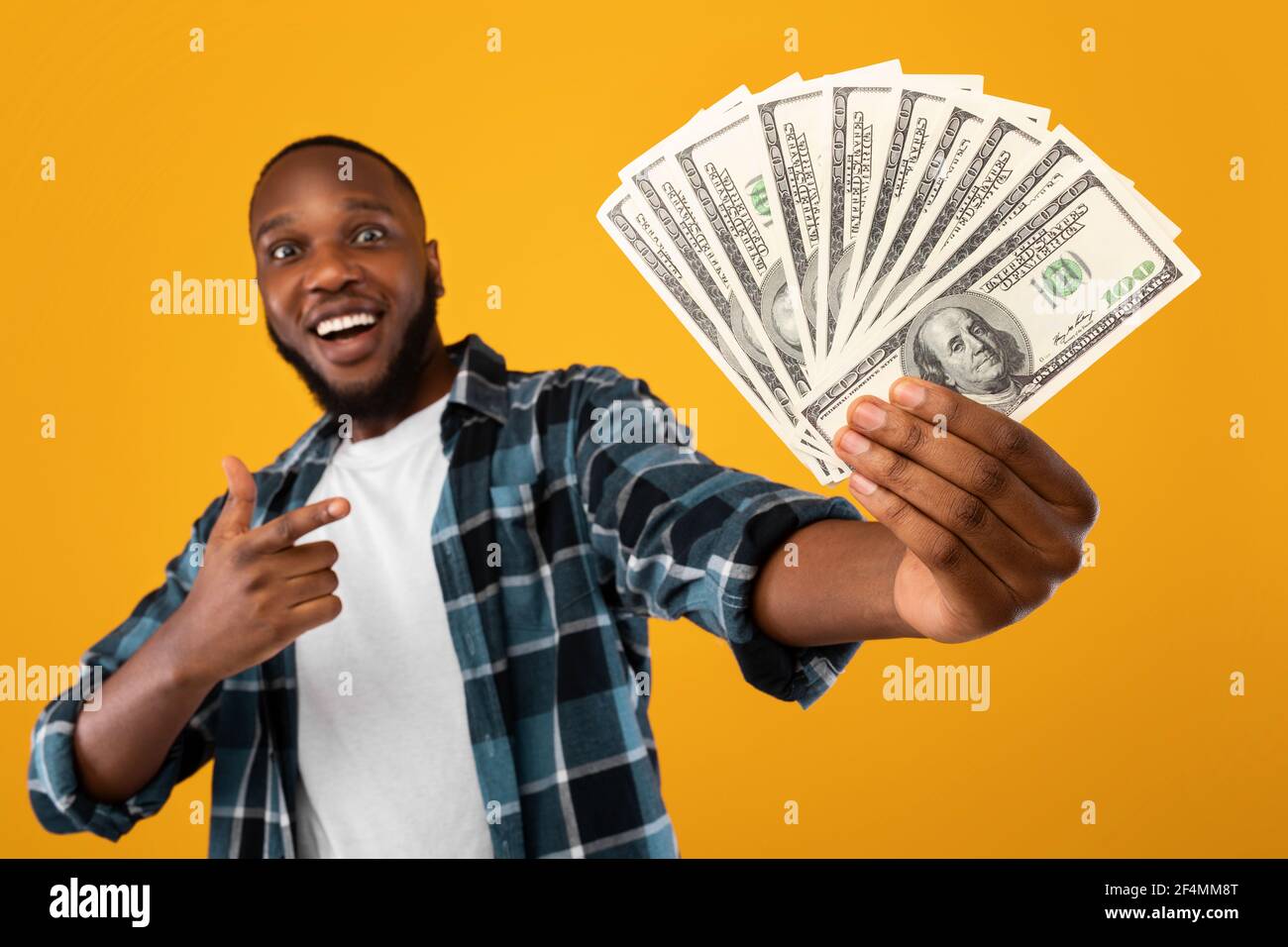 Man showing money and pointing to that hi-res stock photography and ...