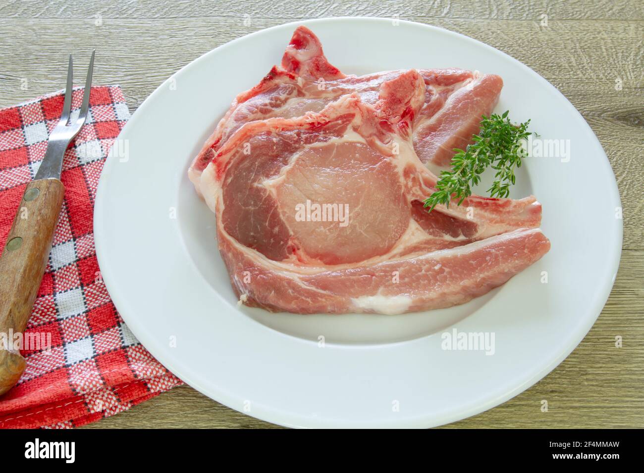 raw pork chop Stock Photo - Alamy