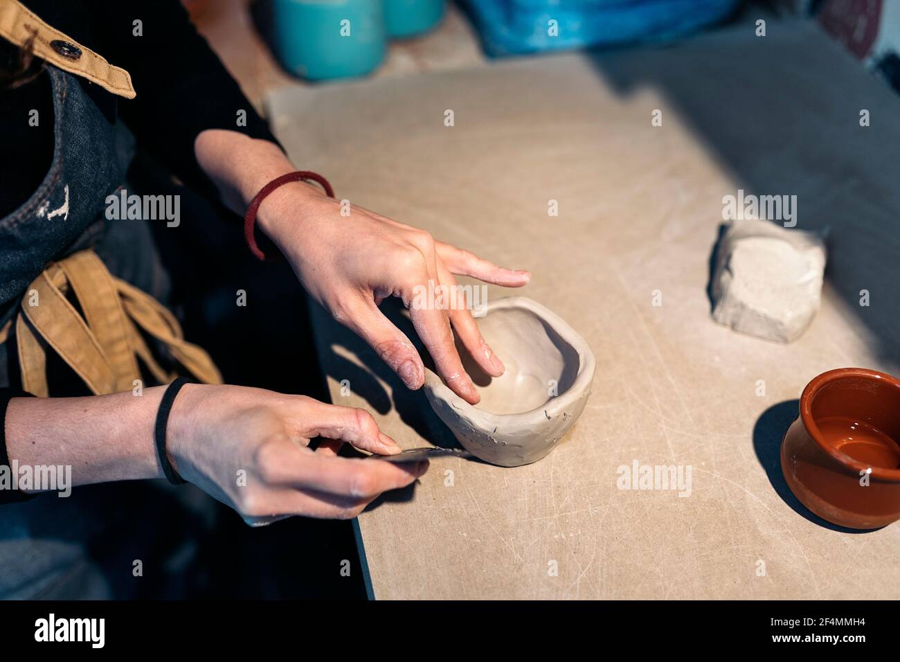 Stock photo of unrecognized person shaping clay in art pottery workshop ...