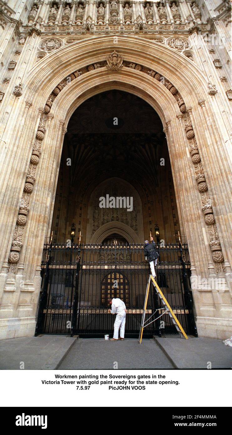 Workmen painting the Sovereigns Gate in the Victoria Tower of the ...