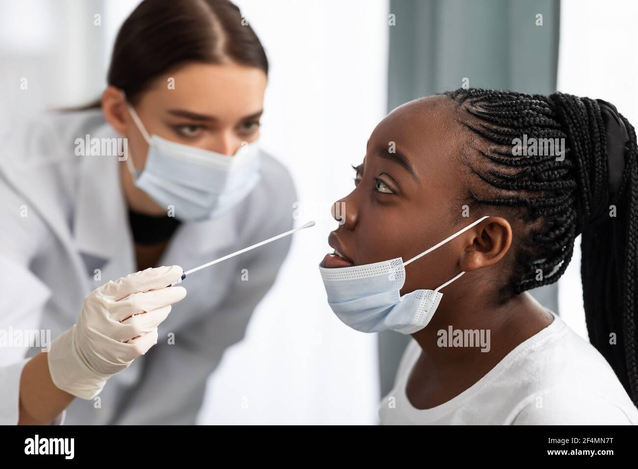 Woman doctor taking sample corona hi-res stock photography and images ...