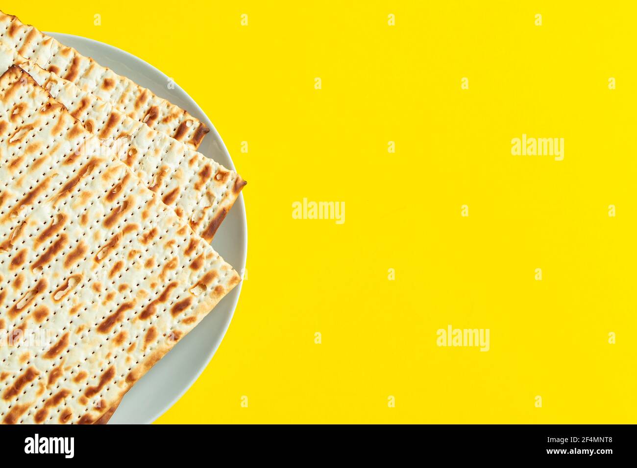 Celebrating the traditional Jewish holiday of Passover. Matzo on yellow ...