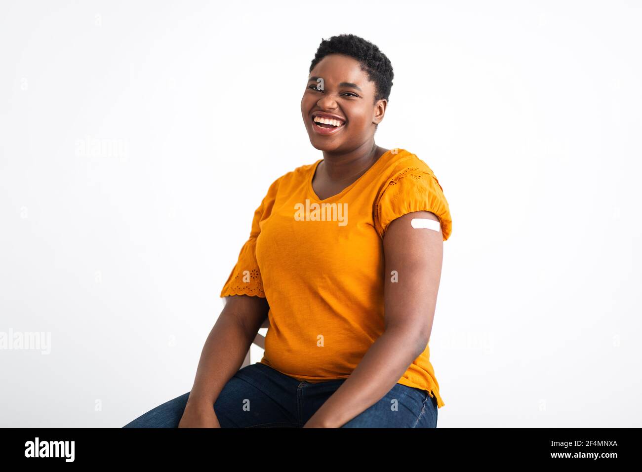 Black Woman Showing Vaccinated Arm After Covid-19 Injection, White ...