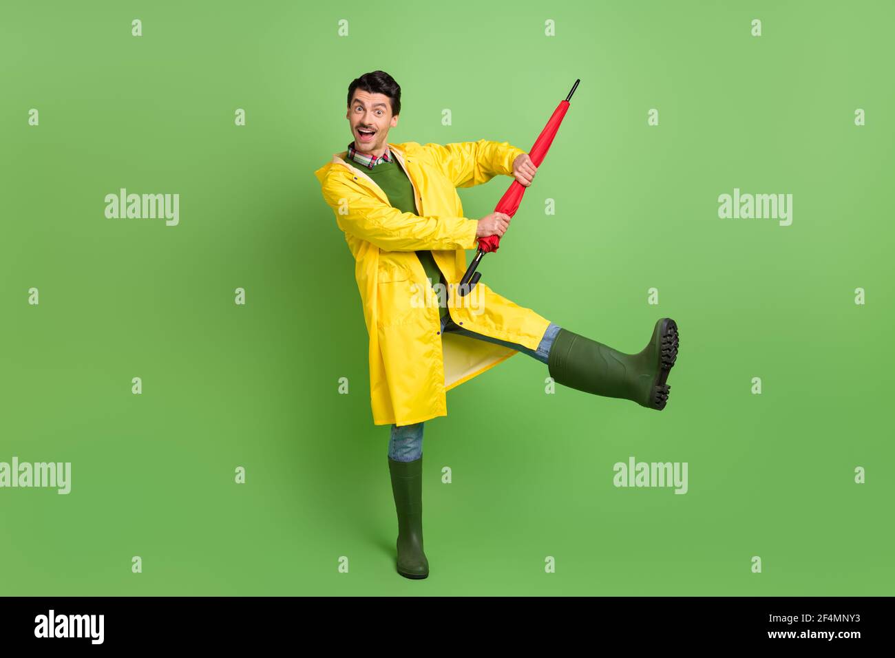 Man in yellow coat hi-res stock photography and images - Alamy