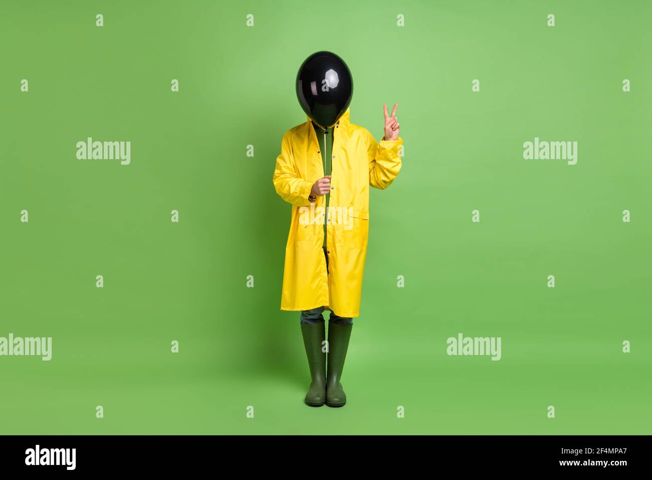 Full length photo of young man incognito cover face air balloon show ...