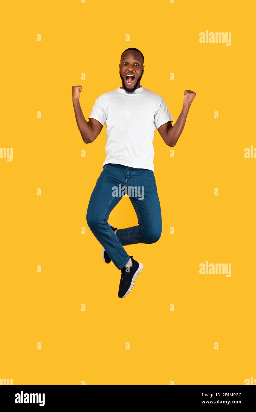 African guy jumping shouting hi-res stock photography and images - Alamy