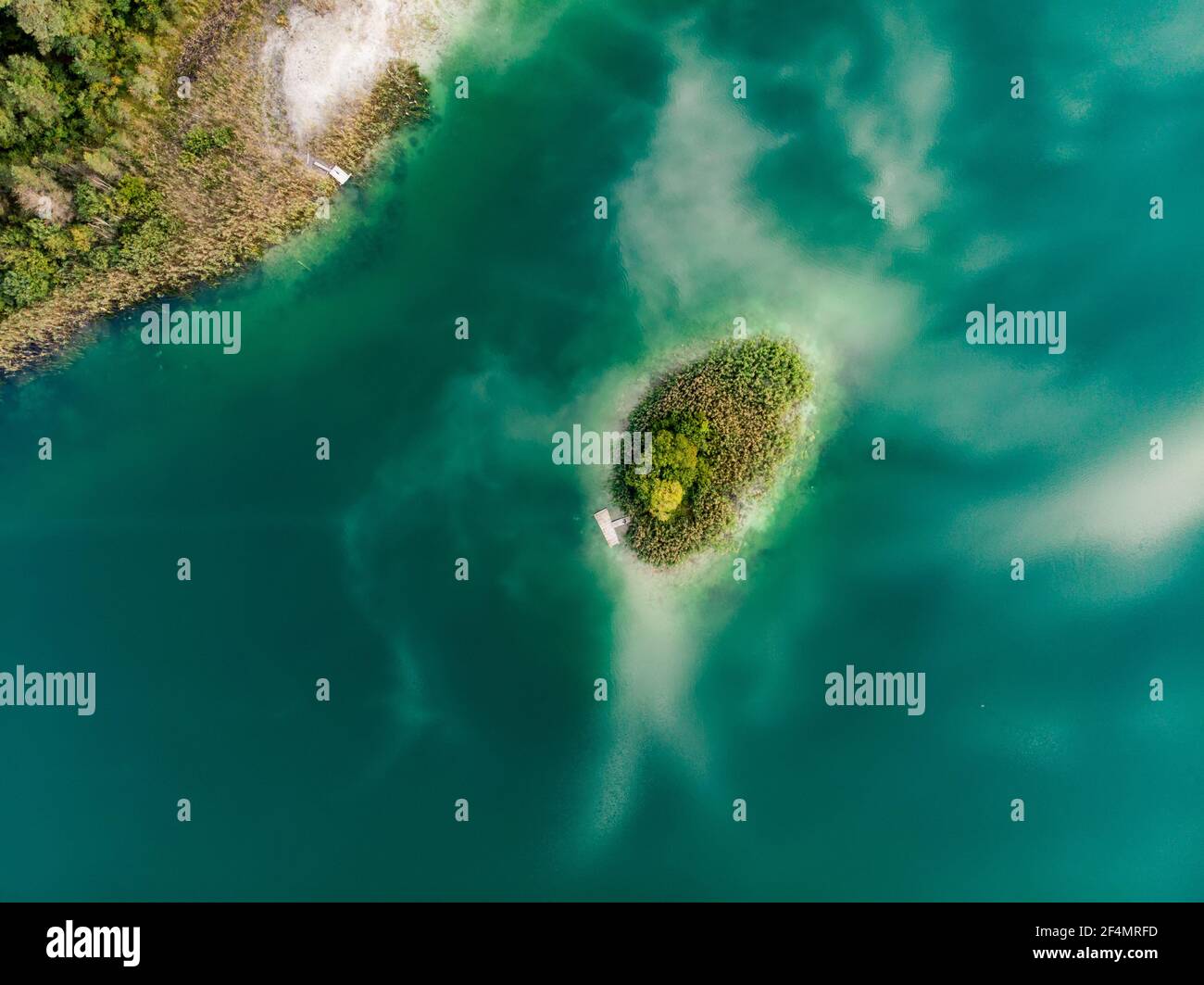 Aerial top down view of small island. Birds eye view of beautiful green ...