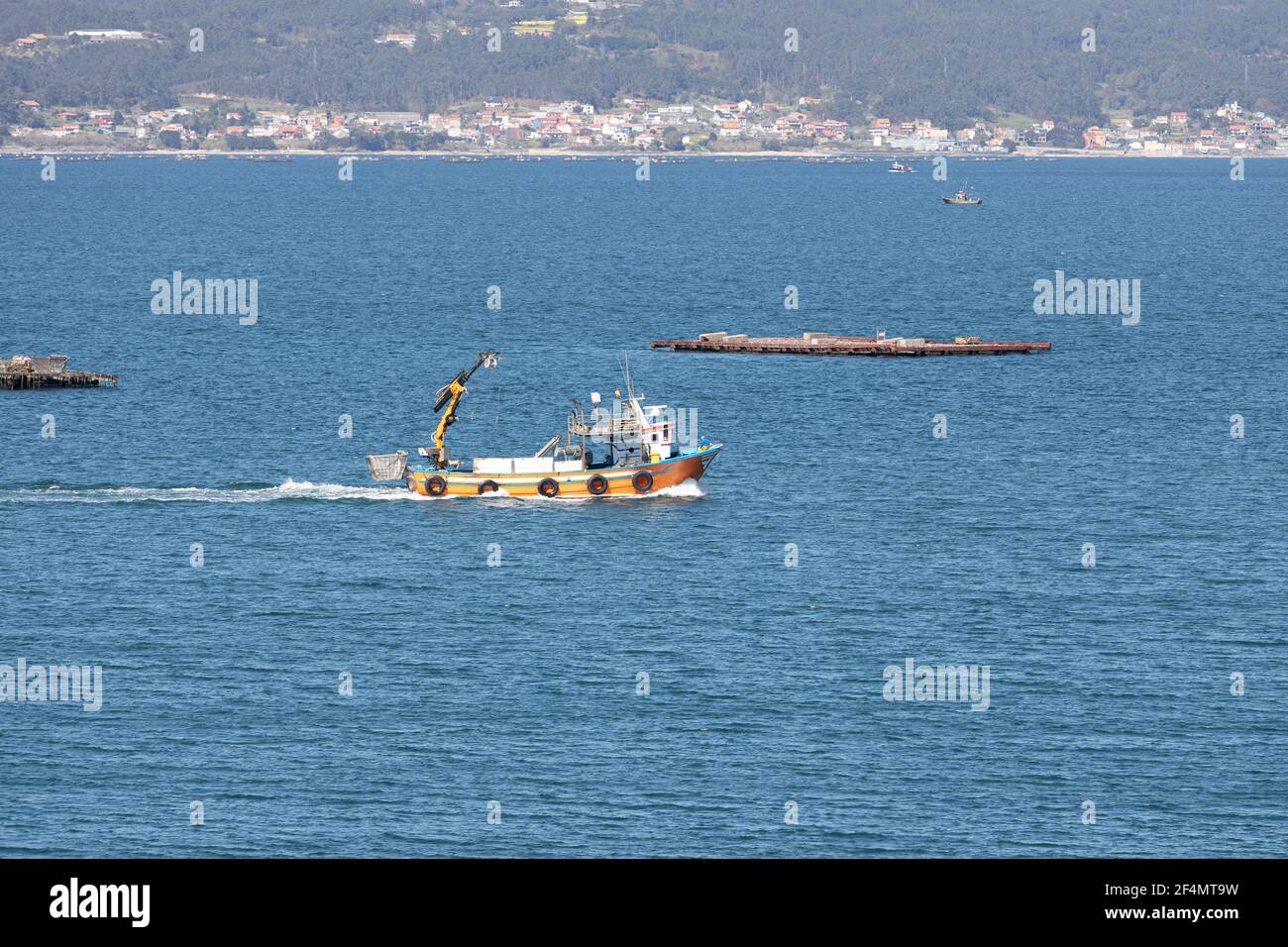 Mussel boat sailing between mussel wood platform called batea Stock ...