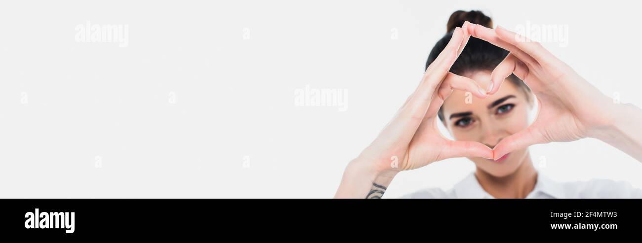 Young woman showing love sign isolated on white, banner Stock Photo - Alamy