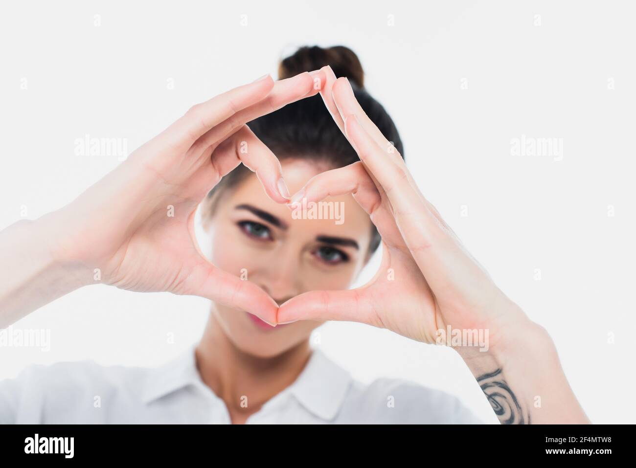 Woman showing heart sign hi-res stock photography and images - Alamy