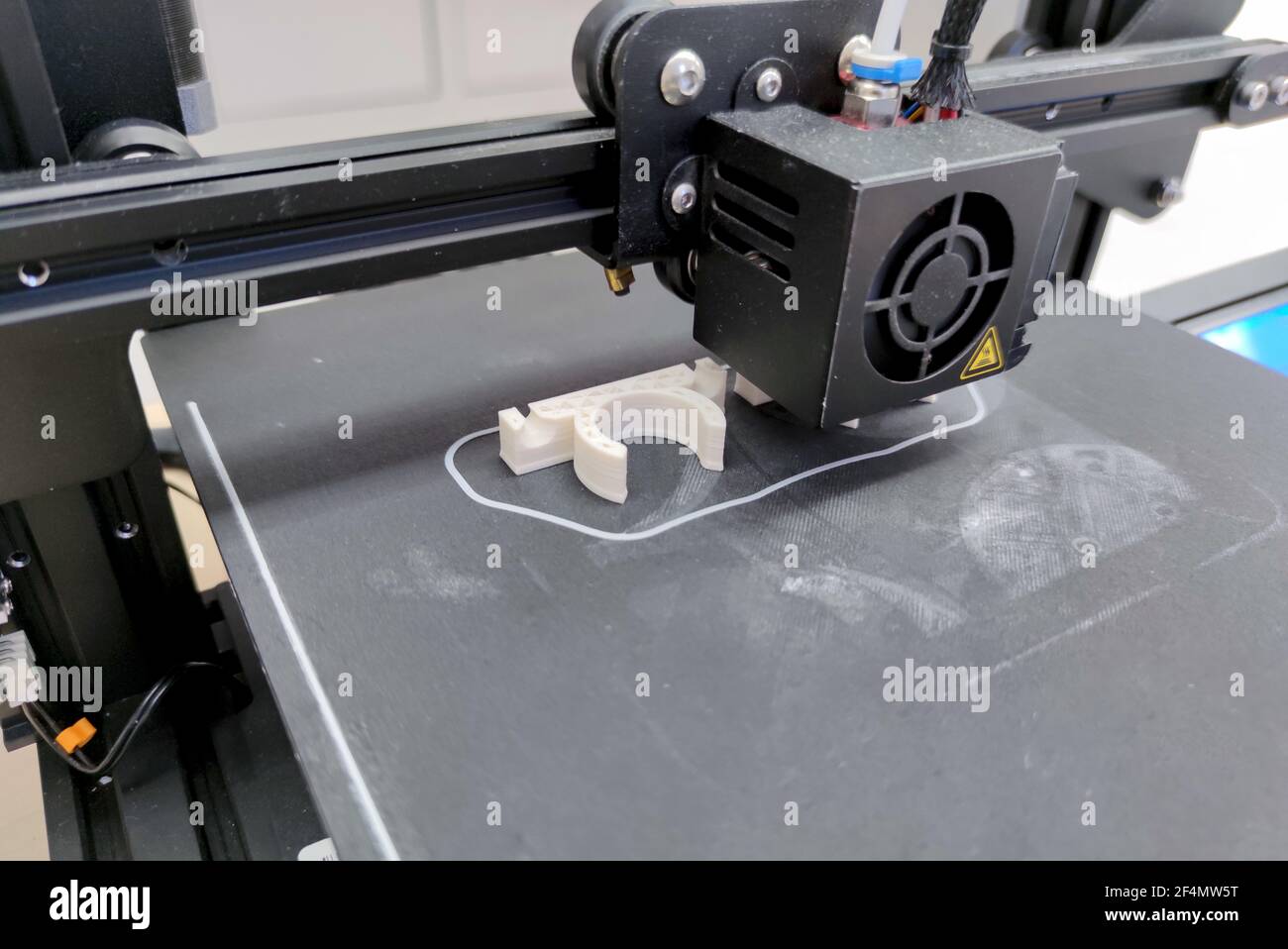 Close-up image of 3d printer printing plastic piece, part Stock Photo ...