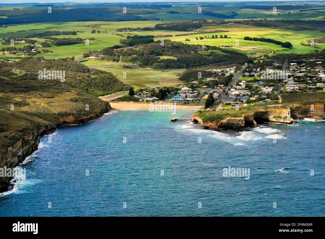 Australia, VIC, aerial view of Port Campbell village with beach and ...