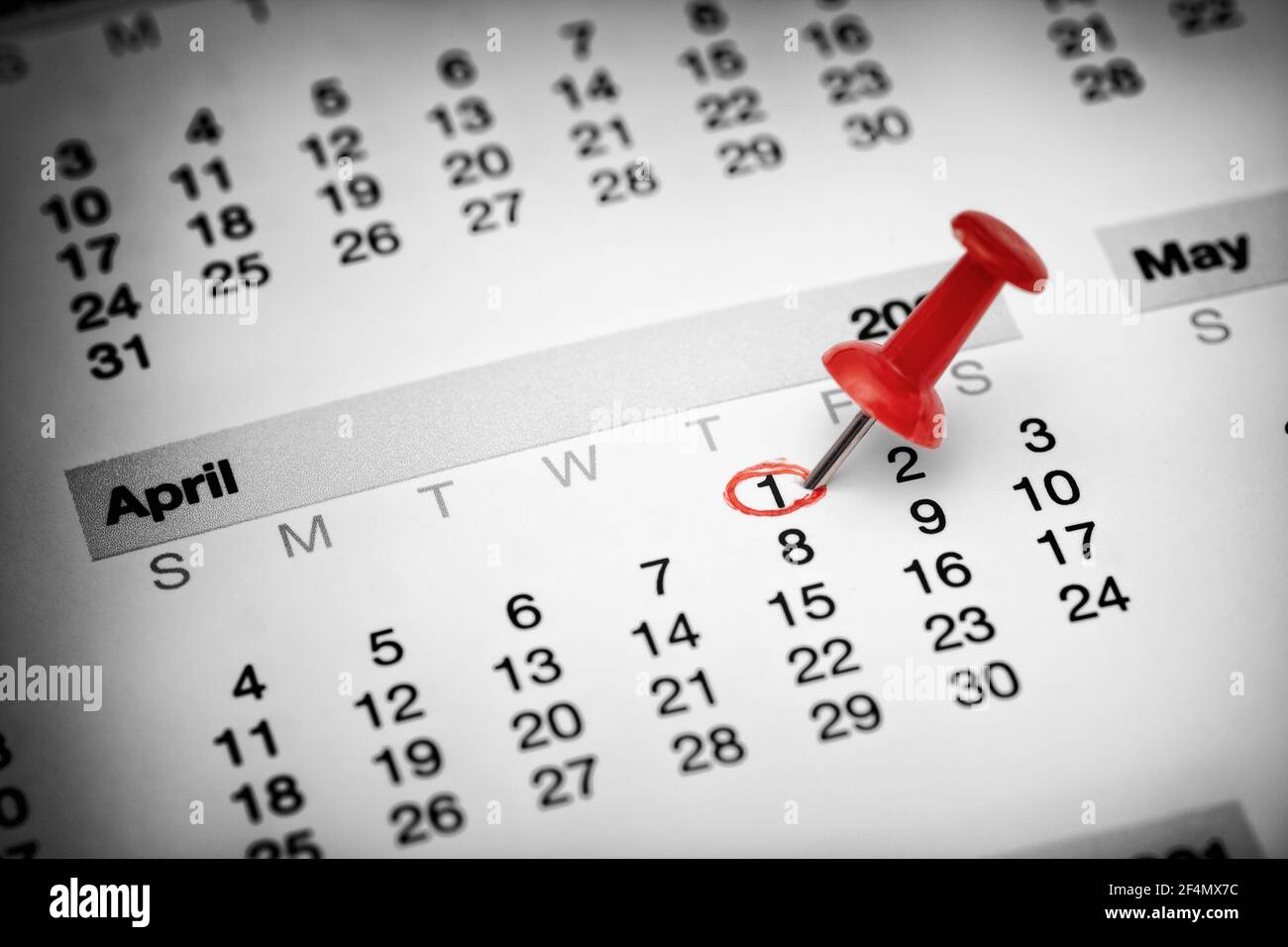 A red pin on the first of april on a calendar. Close up Stock Photo - Alamy