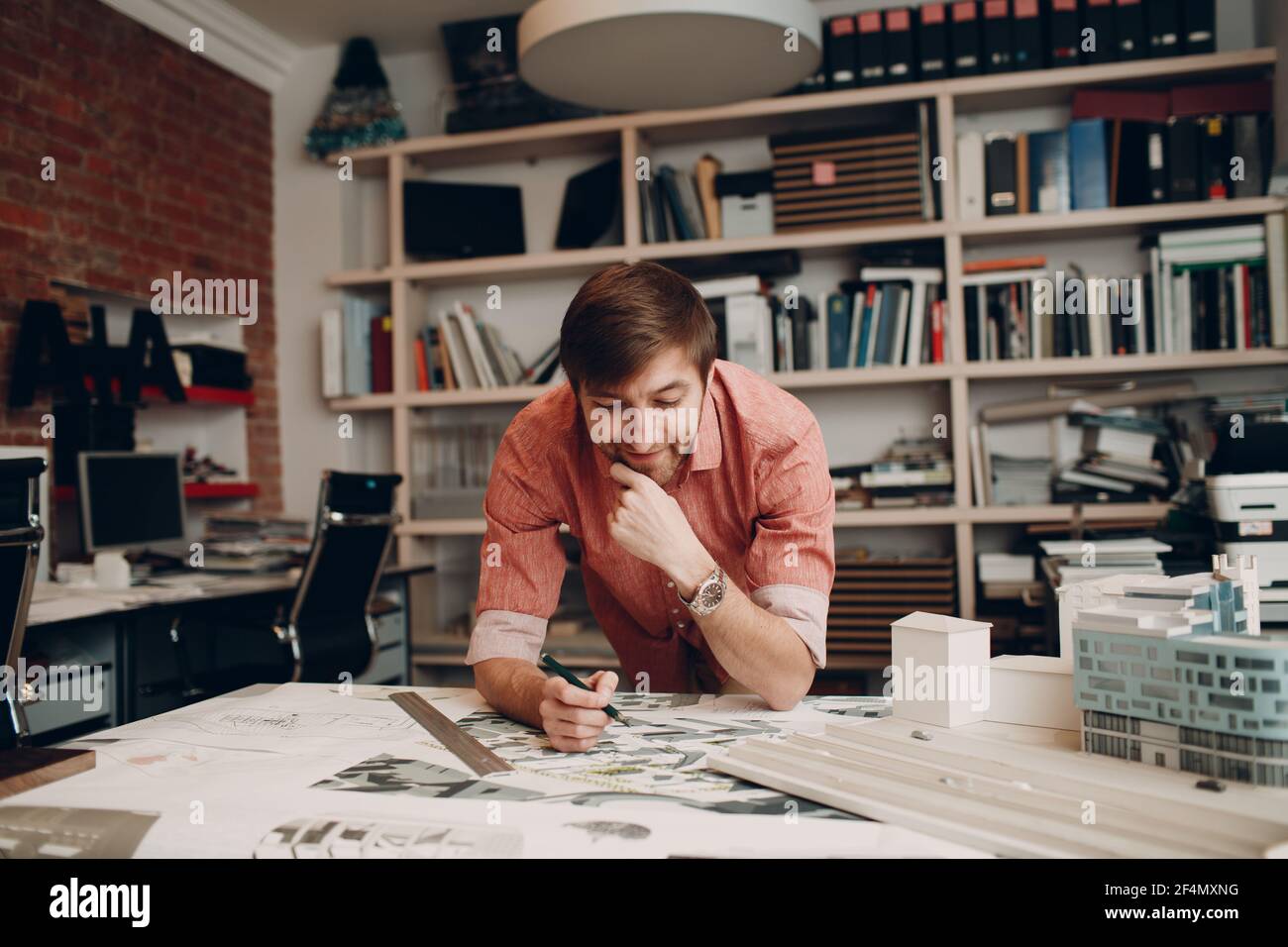 Architect man with blueprints and layout working design project at ...