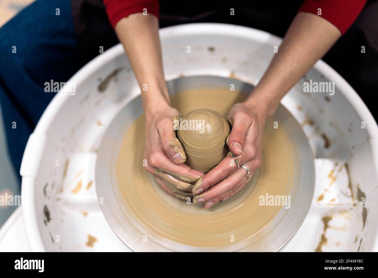 Stock photo of unrecognized person using potter's wheel during pottery ...