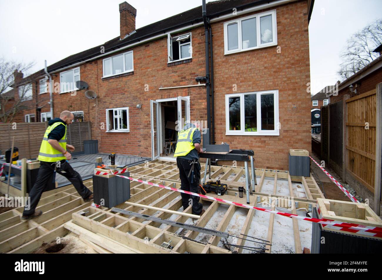 Volunteers from the charity Band of Builders at work in the garden of ...