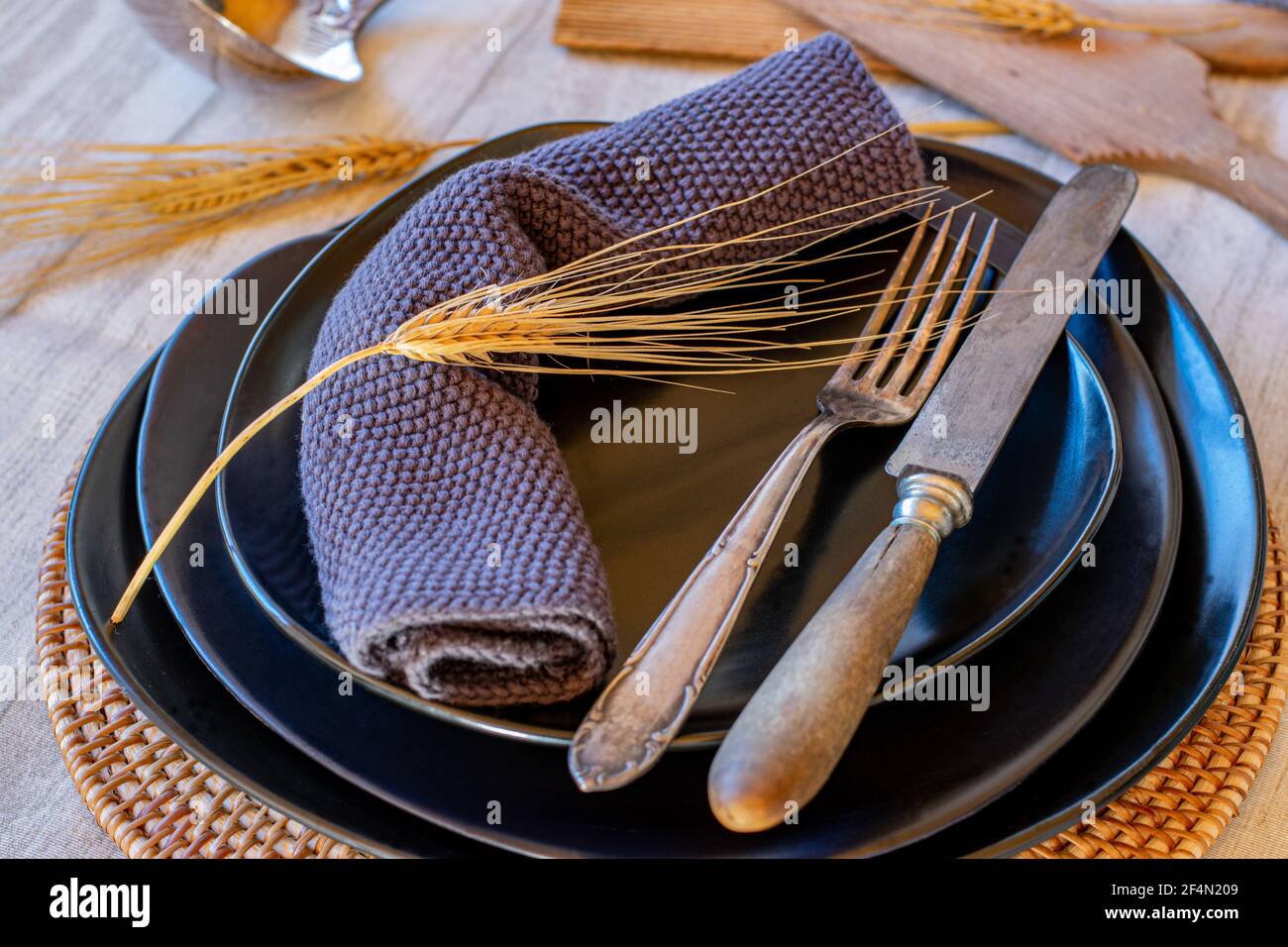 rustic table setting with brown plates Stock Photo - Alamy