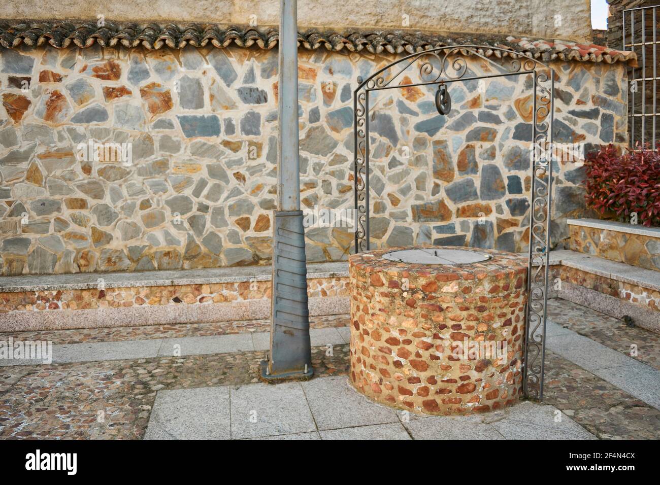 Well curb to draw water made with stone and adobe with decorative ...