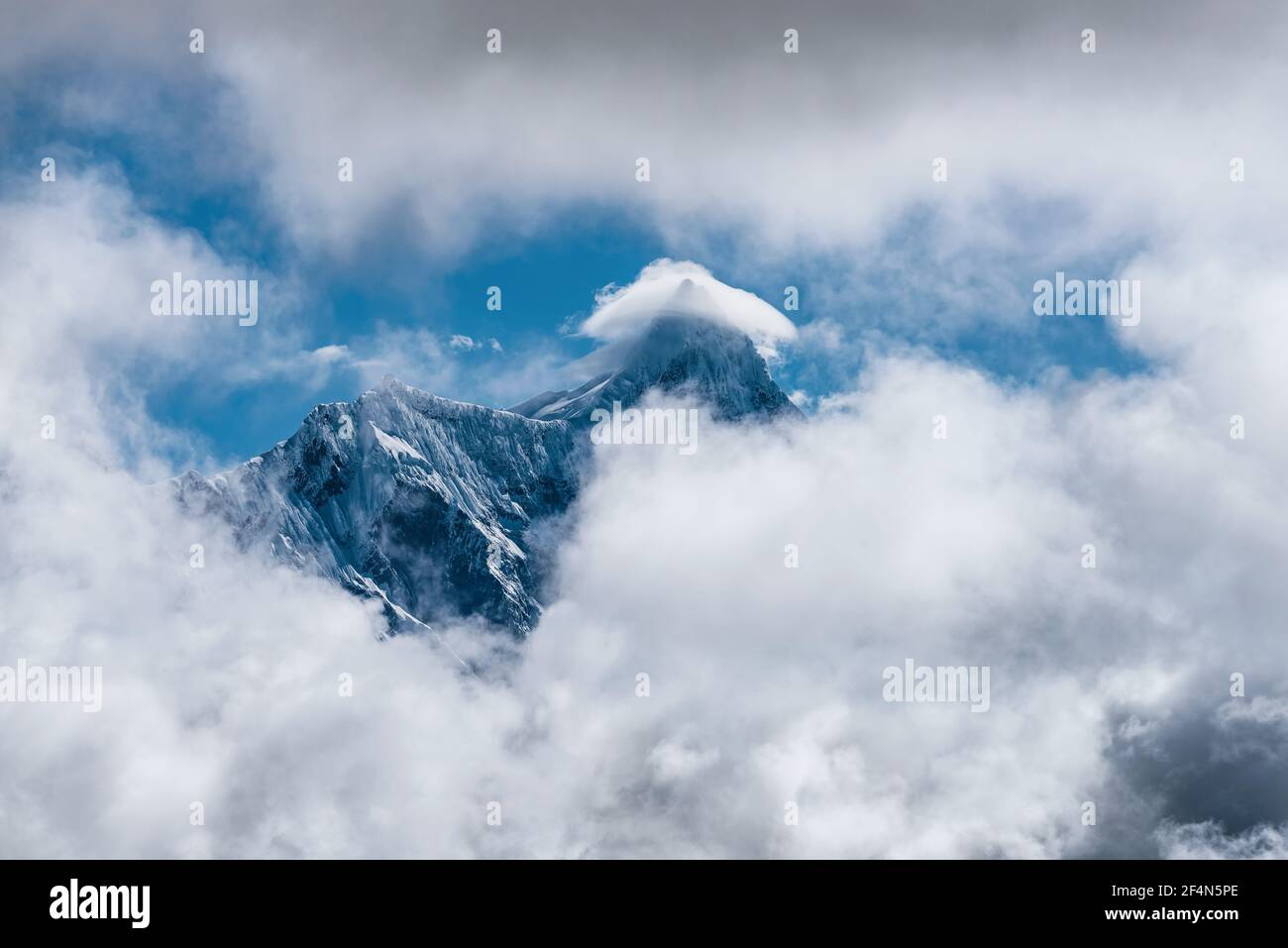 Namcha Barwa Peak in the clouds Stock Photo - Alamy