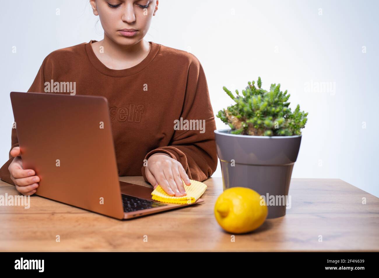 The girl's hand is cleaning the computer keyboard. Cleaning bacteria ...