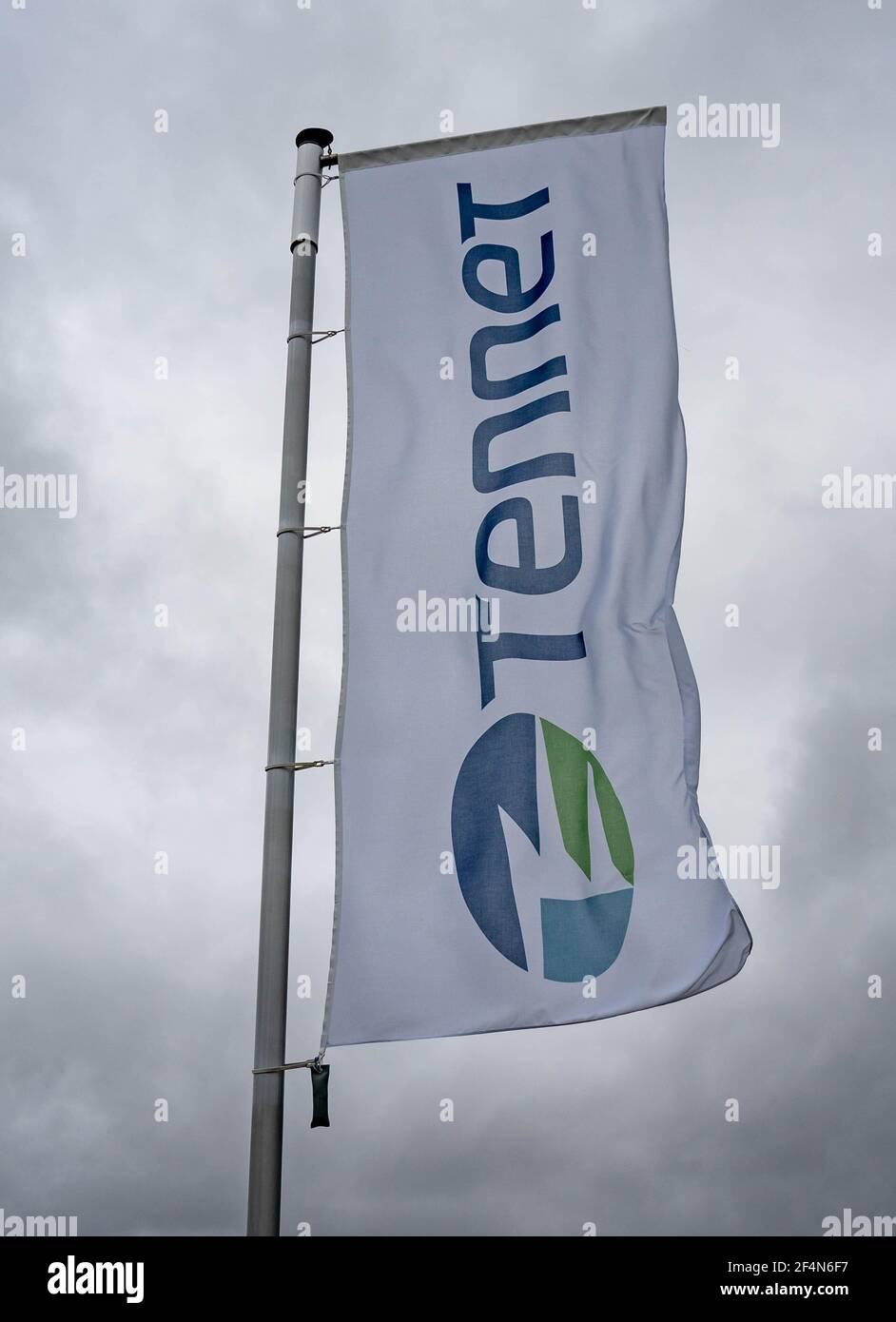 Wilster, Germany. 22nd Mar, 2021. A flag of the company Tennet flies on ...