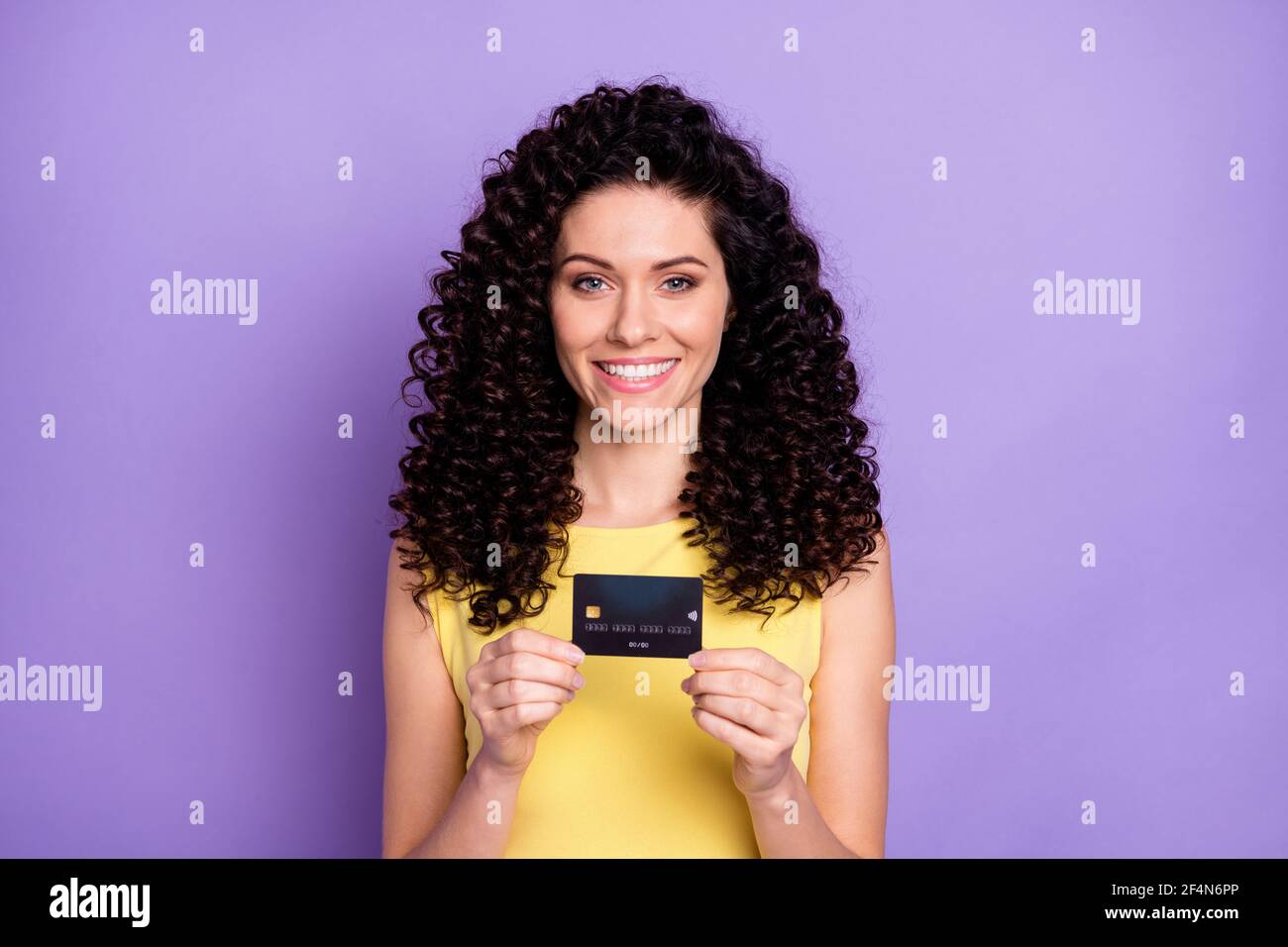 Photo of charming positive person hands hold banking card toothy smile ...