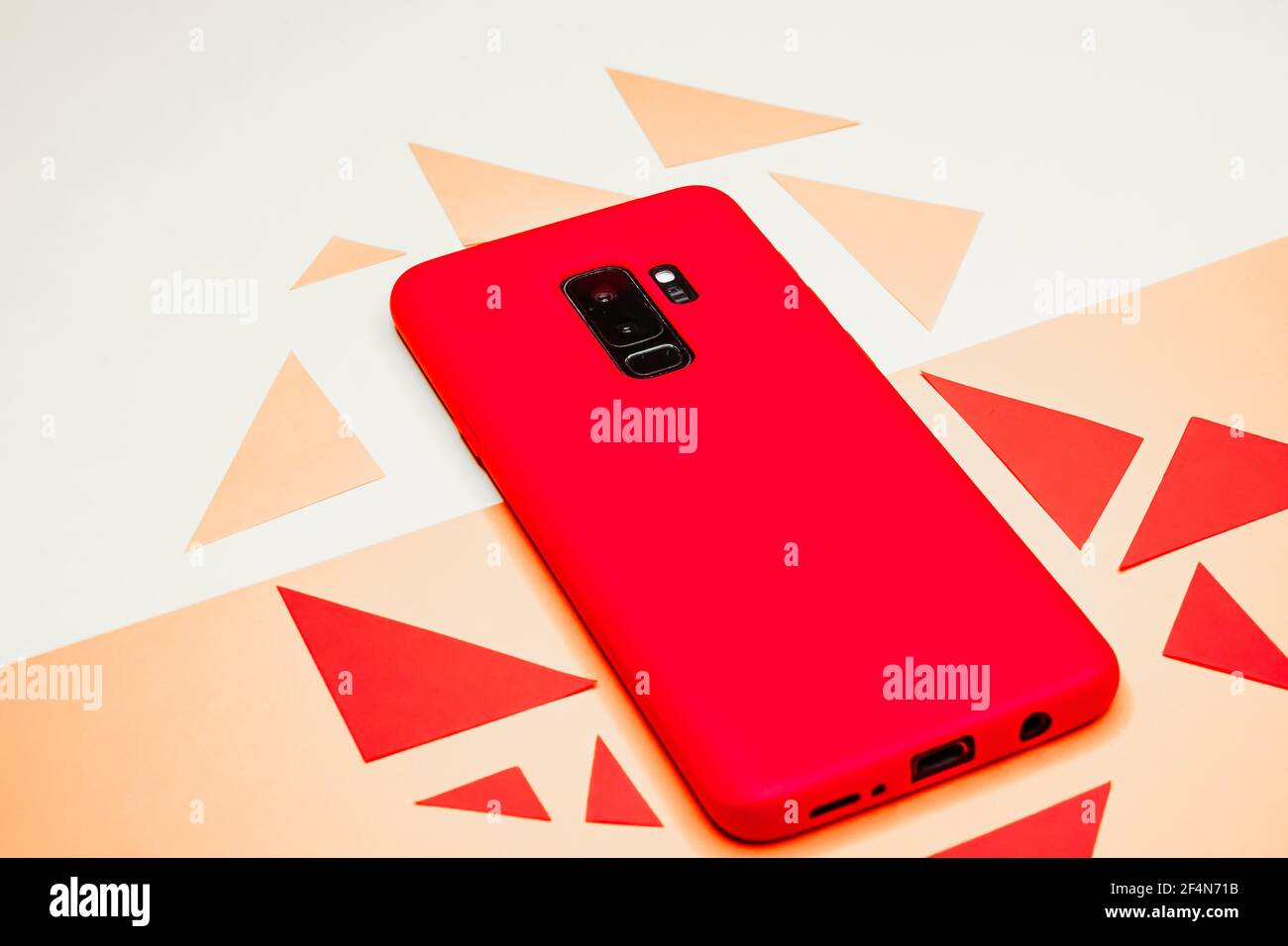 Red mobile phone case isolated on white and red background with copy ...