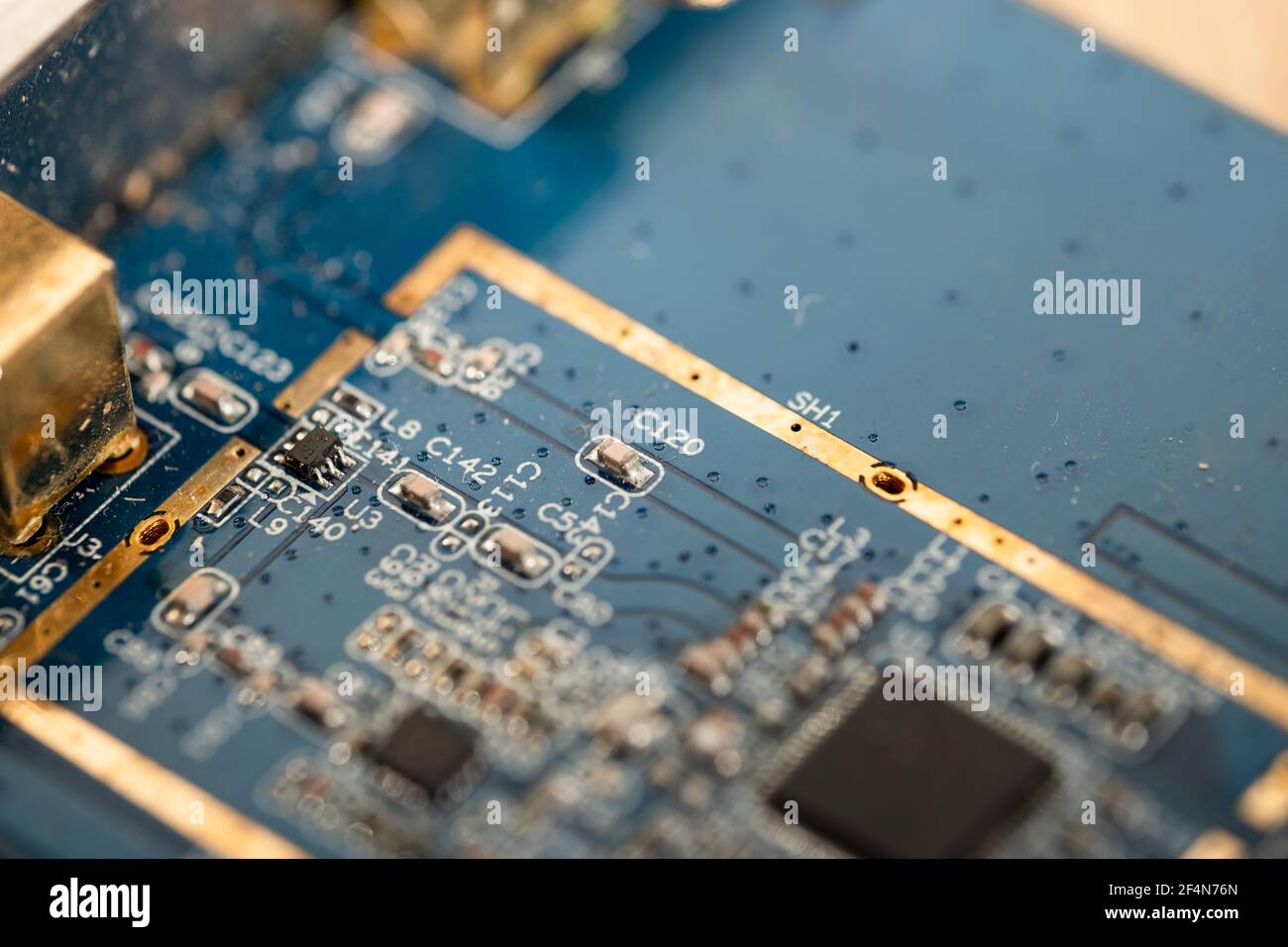 Close-up, shallow focus of surface mounted components seen on the PCB ...