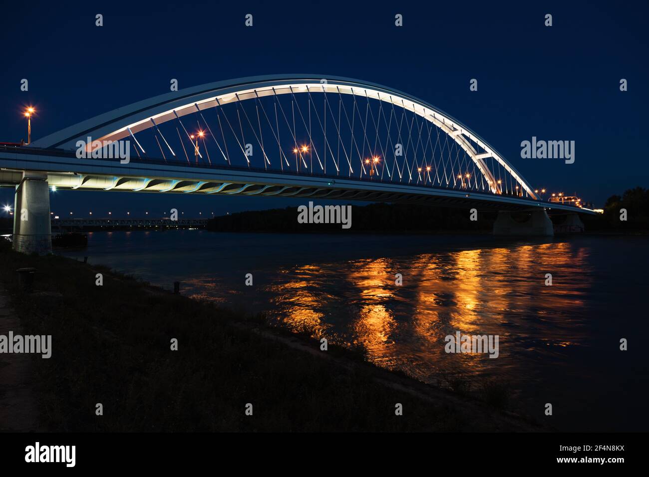 Apollo bridge on Danube river by night Stock Photo - Alamy