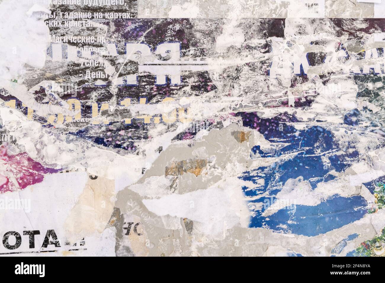 Collage of many numbers and letters ripped torn advertisement street ...