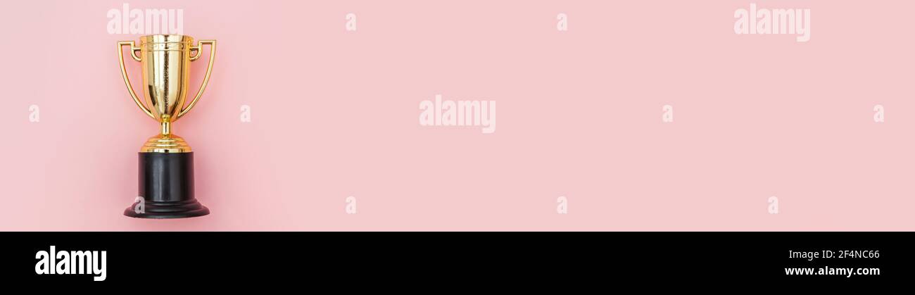 Simply flat lay design winner or champion gold trophy cup isolated on ...