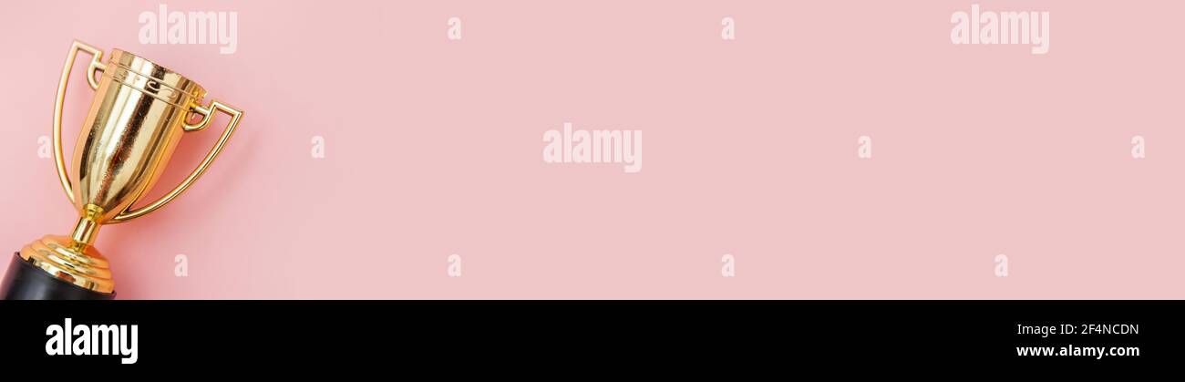 Simply flat lay design winner or champion gold trophy cup isolated on ...