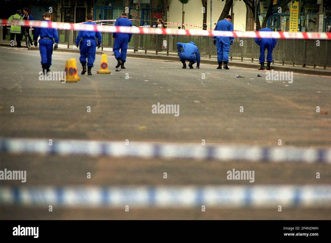 Police search the street outside the bombed MI6 building Stock Photo ...