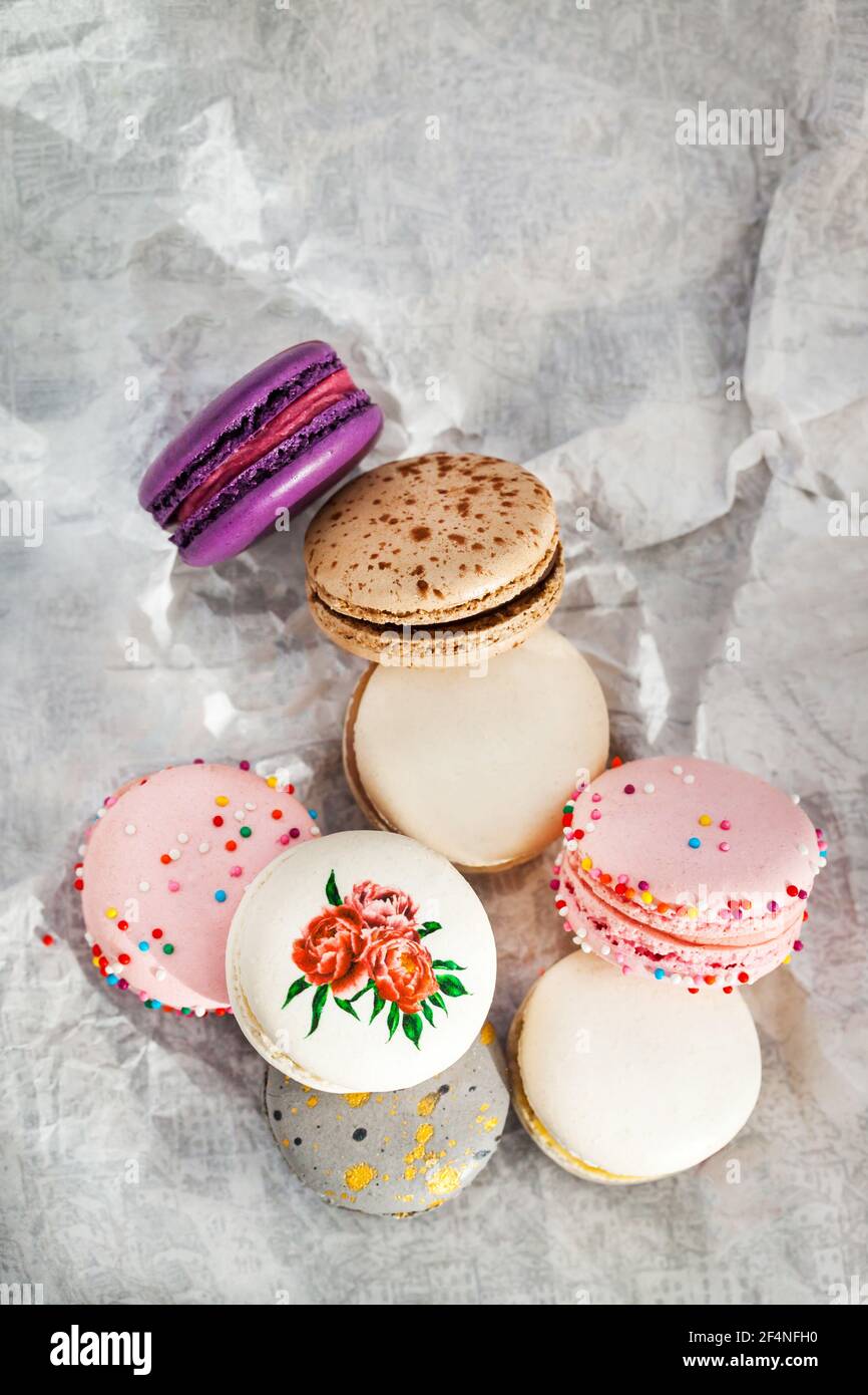 Colorful french macarons on gray background. Pastel colors. Top view ...