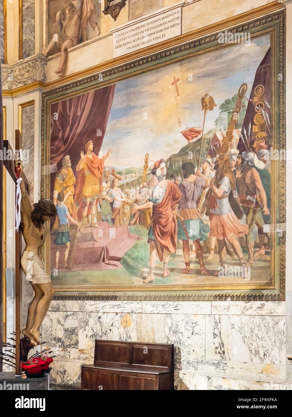 Detail of religious fresco and big wooden crucifix decorating the ...