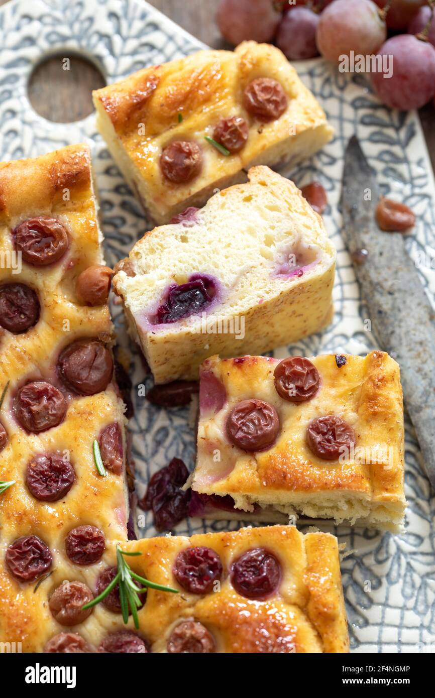 Top view of homemade sweet cakes with red grapes on a board Stock Photo ...