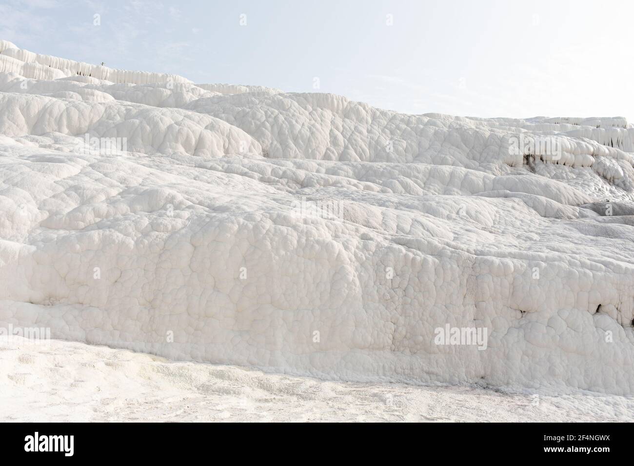 White texture cloudy calcium surface of Pamukkale mineral mountain in ...
