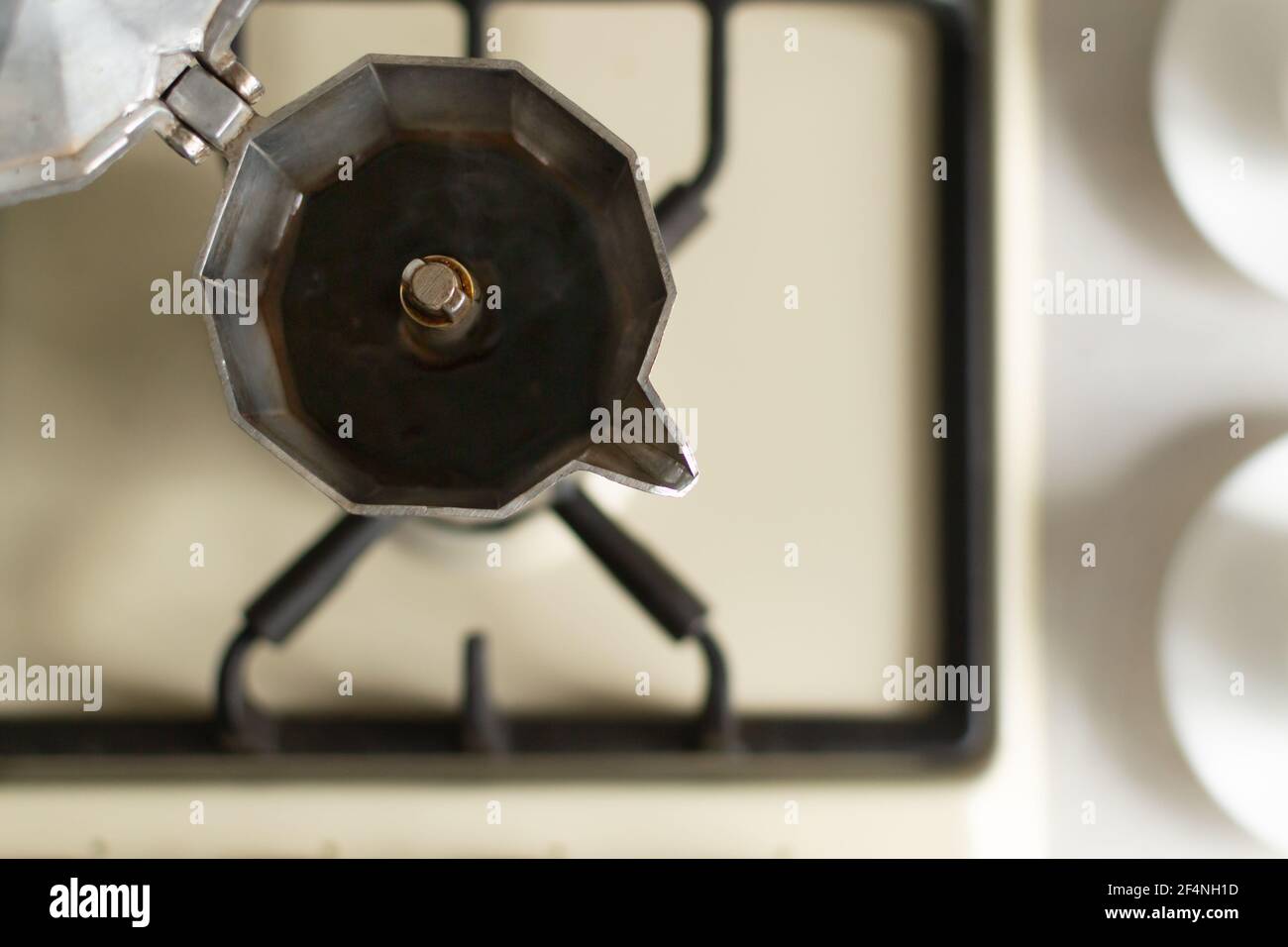 Geyser coffee maker on the stove. The concept of making coffee at home ...