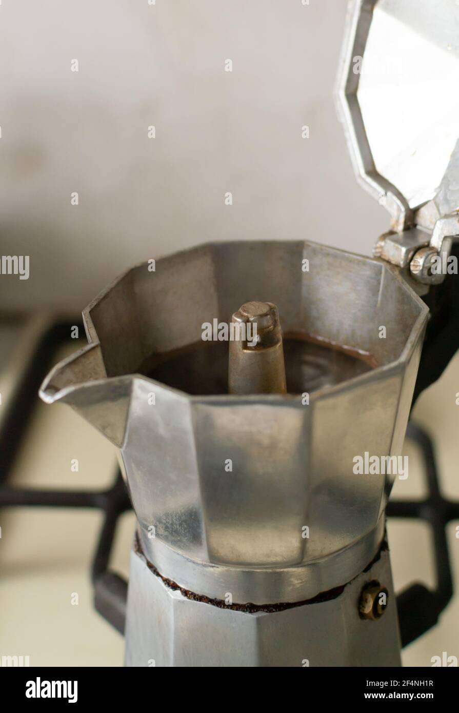 Geyser coffee maker on the stove. The concept of making morning coffee ...