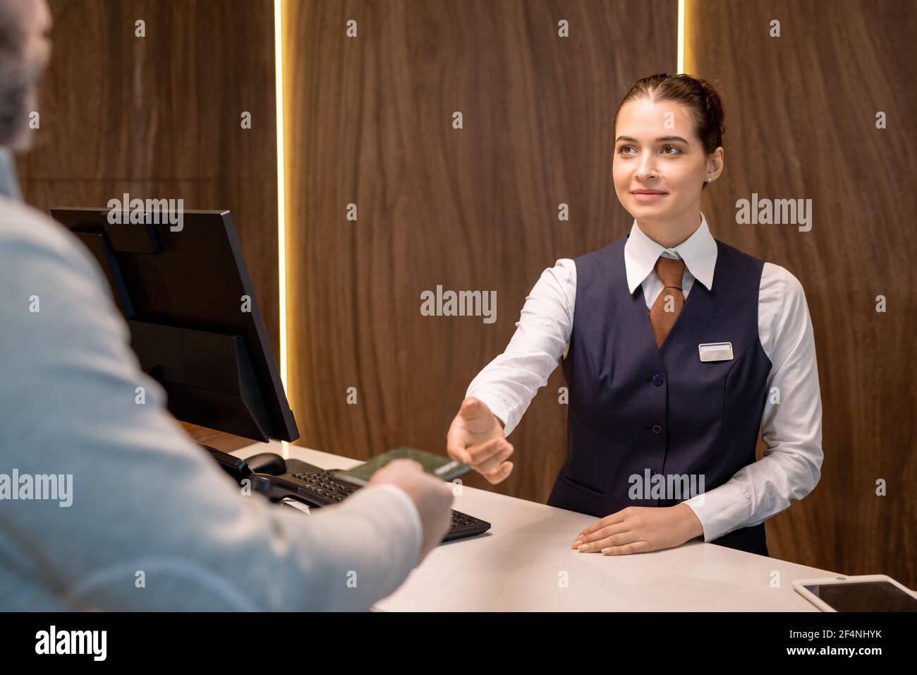 Standing smiling greeting communication uniform hi-res stock ...