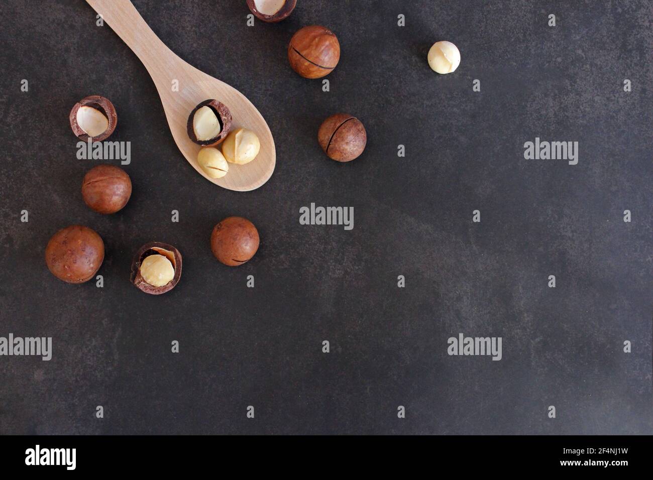 Various nuts on stone table. Top view with copy space Stock Photo - Alamy
