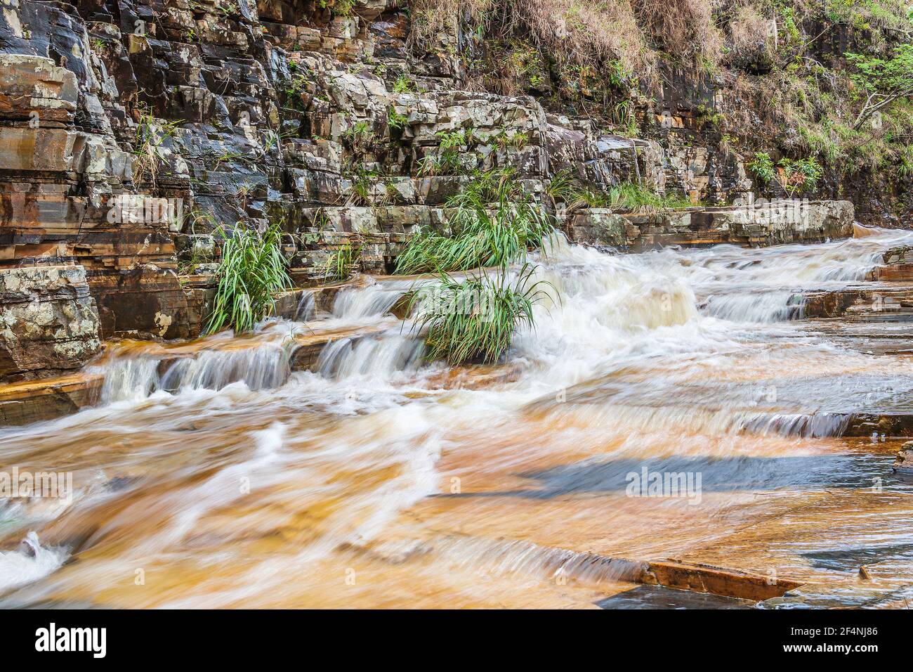 Water stream running by sedimentary rocks. Natural beauties of ...