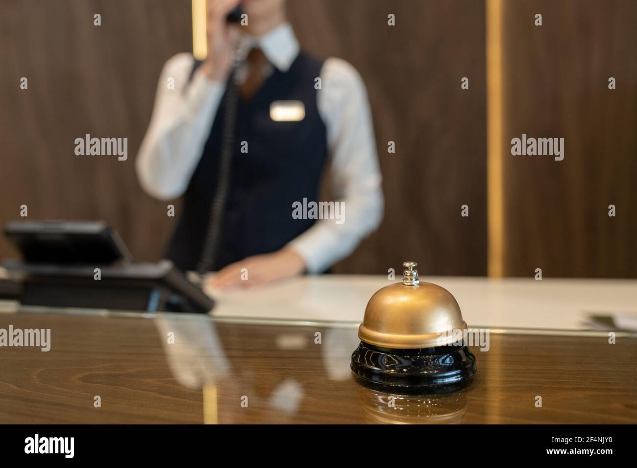 Hotel lobby with wooden reception desk hi-res stock photography and ...