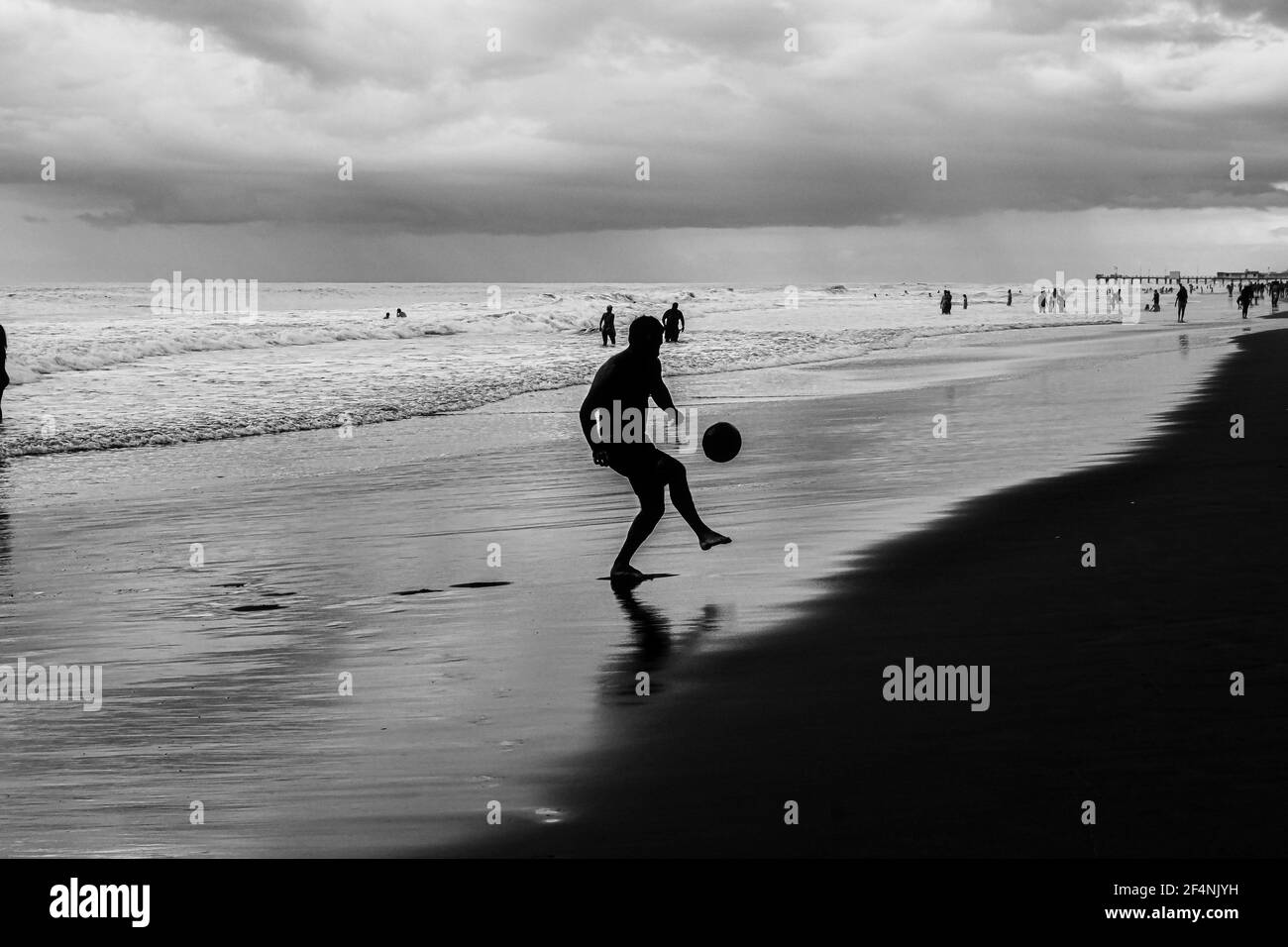 Group of people playing around and having fun on the beach a Stock ...
