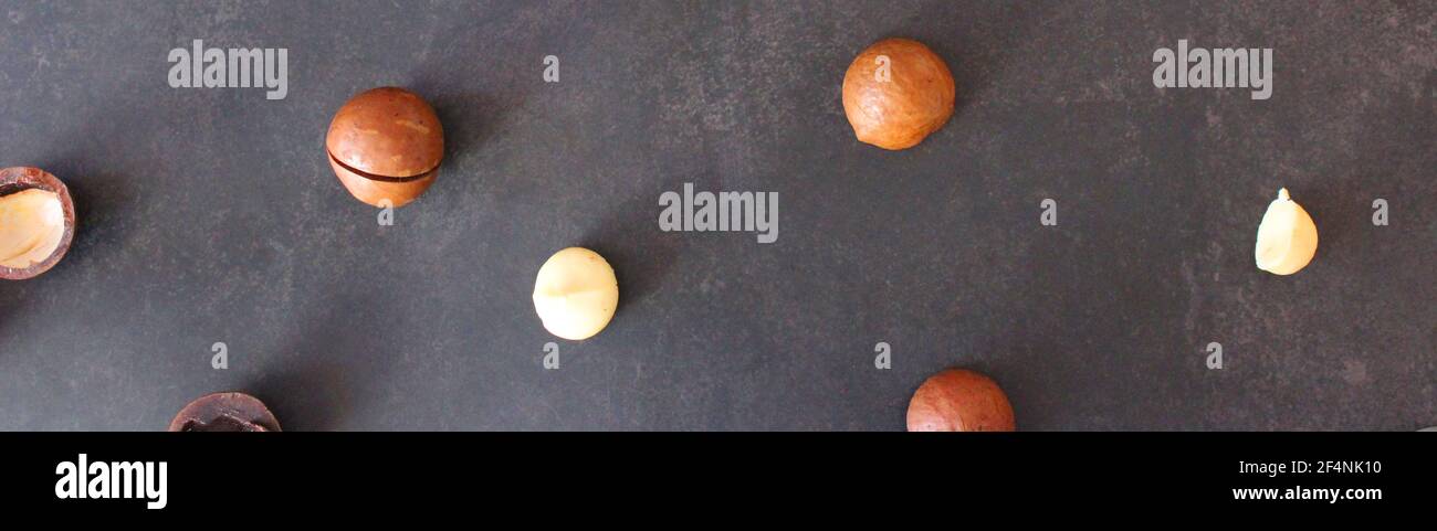 Various nuts on stone table. Top view with copy space Stock Photo - Alamy
