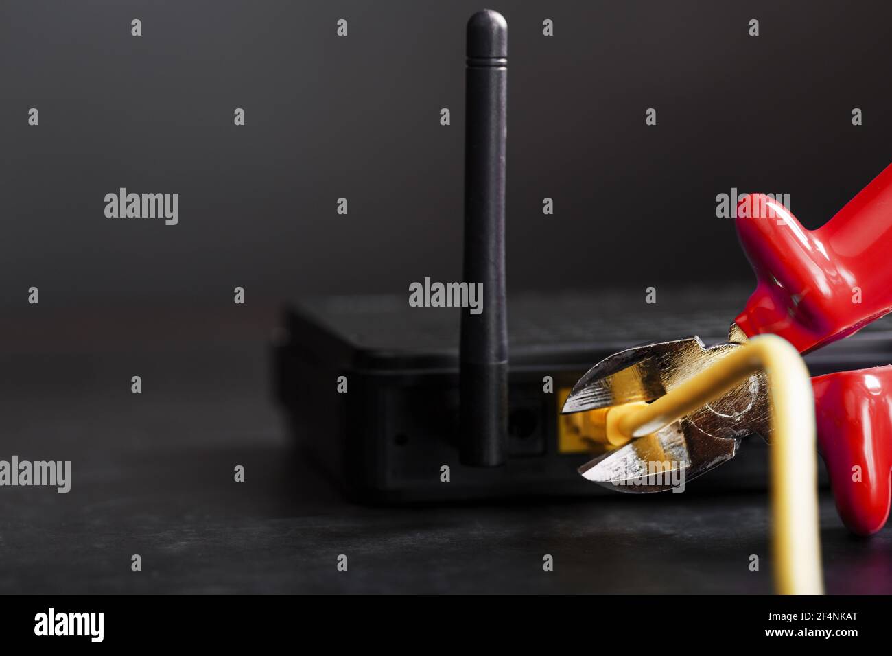 Disconnecting the Internet connection, cutting off the yellow Ethernet ...